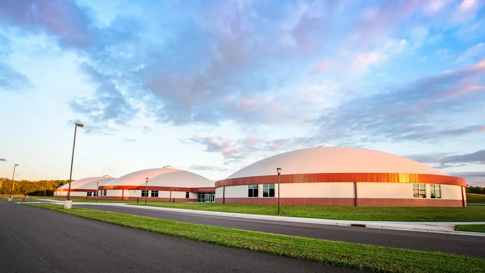 Image: Sunset photo of Johnson Creek school - Monolithic Dome Institute