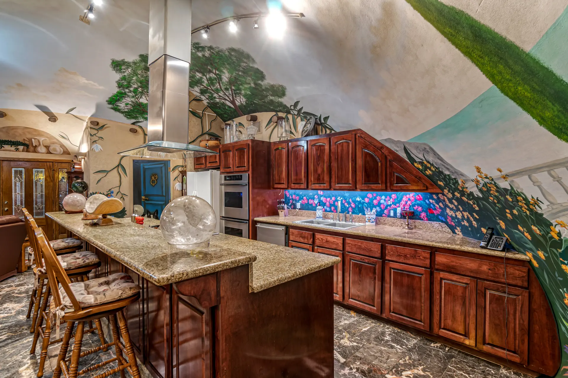 Image: The upgraded kitchen features a stainless steel vent hood and ...