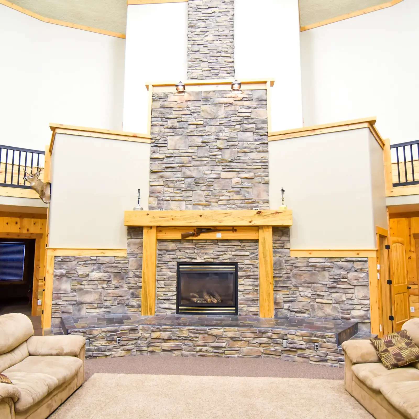 Image: Giant, rocked fireplace is the centerpiece of the living room ...