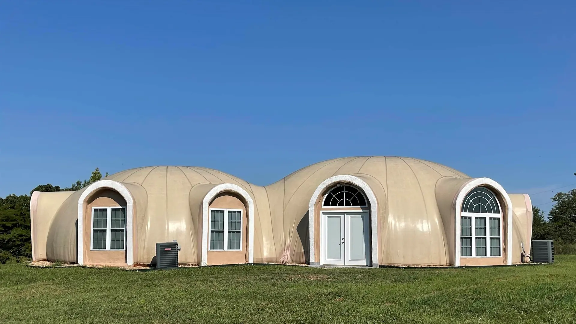 Image: View of the dome from the back yard. - Monolithic Dome Institute