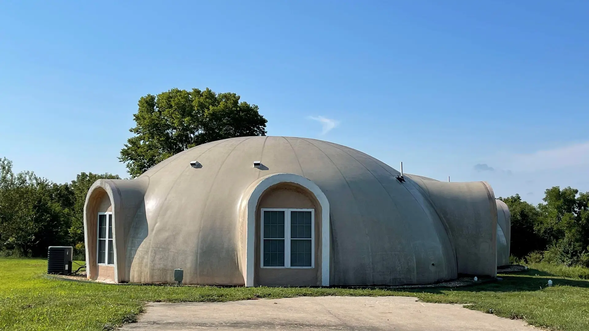 Image: View of the house from the driveway. - Monolithic Dome Institute